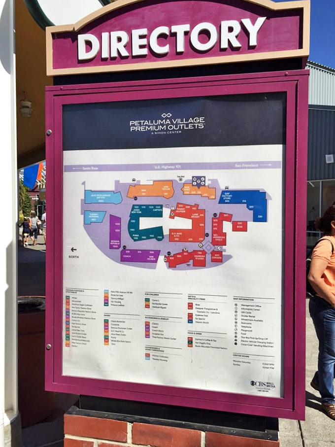 The outlet directory stands like a treasure map, with each store location promising its own version of retail gold for those willing to explore.