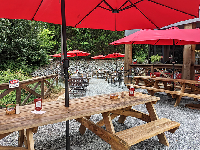 Red umbrellas shade wooden picnic tables in this outdoor oasis. Georgia's version of al fresco dining comes with a side of Southern hospitality.