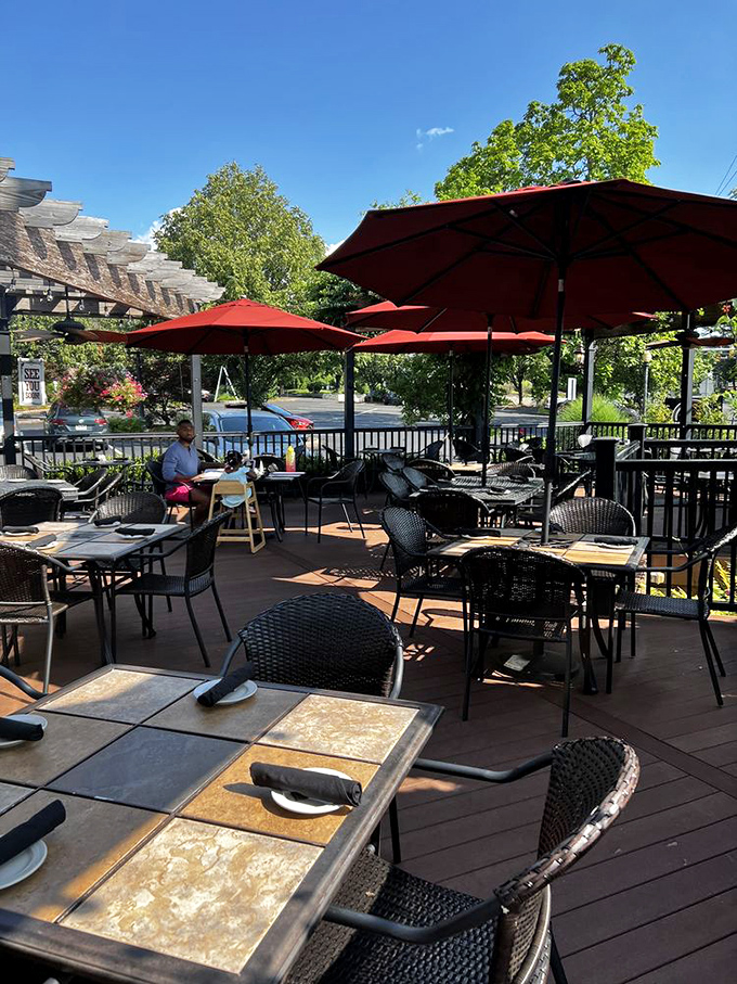 Summer perfection is an outdoor table under Spring House Tavern's red umbrellas, where fresh air enhances every bite.
