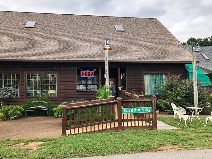 "Casual Fine Dining" reads the sign outside, perfectly capturing the unpretentious elegance that awaits beyond the wooden railing.