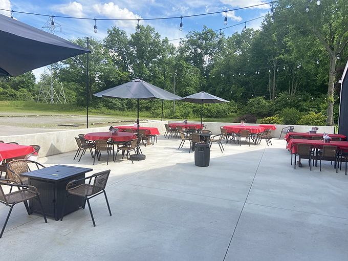 The outdoor seating area, with its string lights and red tablecloths, transforms ordinary summer evenings into memory-making occasions.
