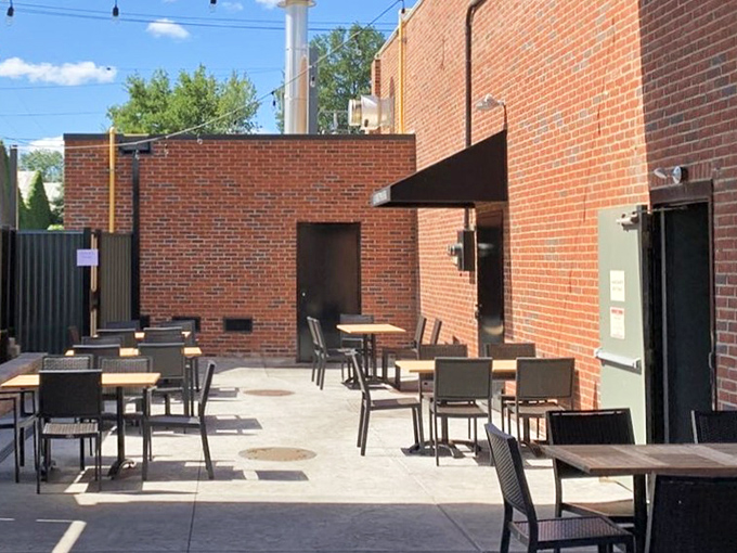 The outdoor seating area offers an urban oasis for those who prefer their smoke-kissed meats with a side of fresh air.