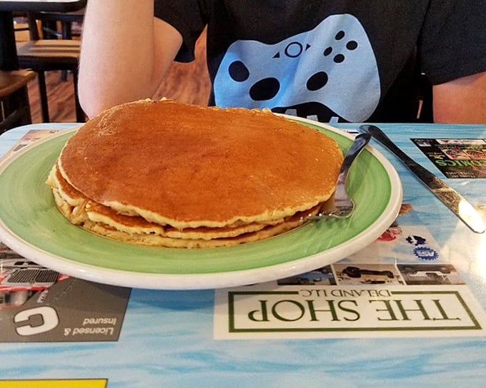 Pancakes so perfectly golden they could win medals, stacked higher than your weekend to-do list.