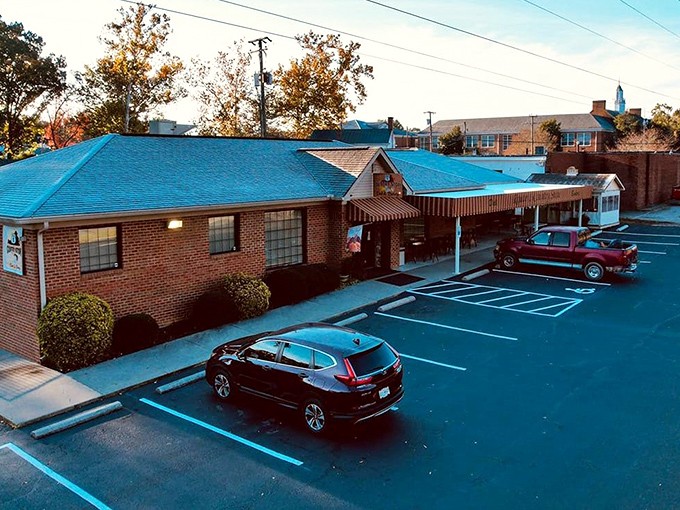 As evening approaches, the store's warm lights glow like a beacon for hungry travelers seeking refuge from fast food mediocrity.