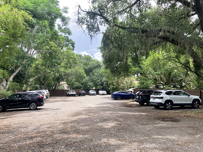 A parking lot shaded by majestic Florida oaks&mdash;nature's way of saying "slow down, you're about to experience something worth savoring."