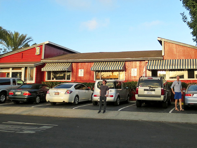 The parking lot at Harbor House—where vehicles gather like hungry pilgrims at a temple of breakfast worship.