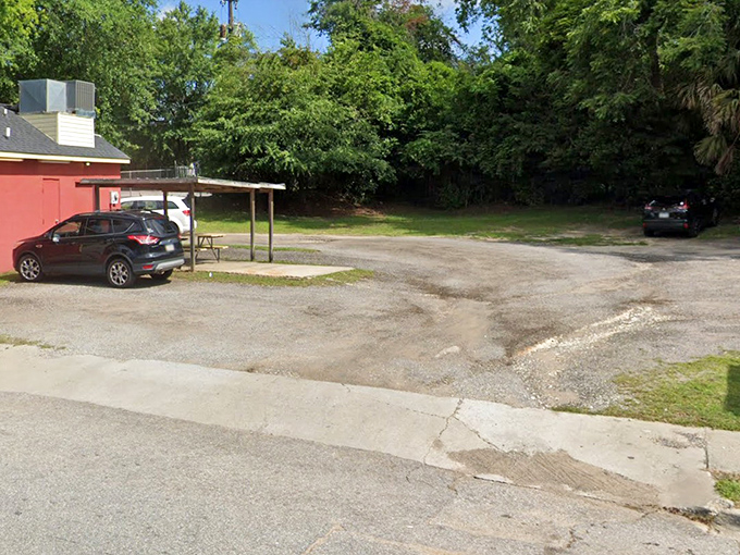 The humble parking area has witnessed countless hot dog pilgrimages. These gravel spots have held everything from Bentleys to bicycles.