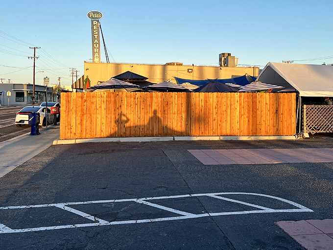 The vertical sign stands tall against the California sky, a landmark for those seeking breakfast salvation.