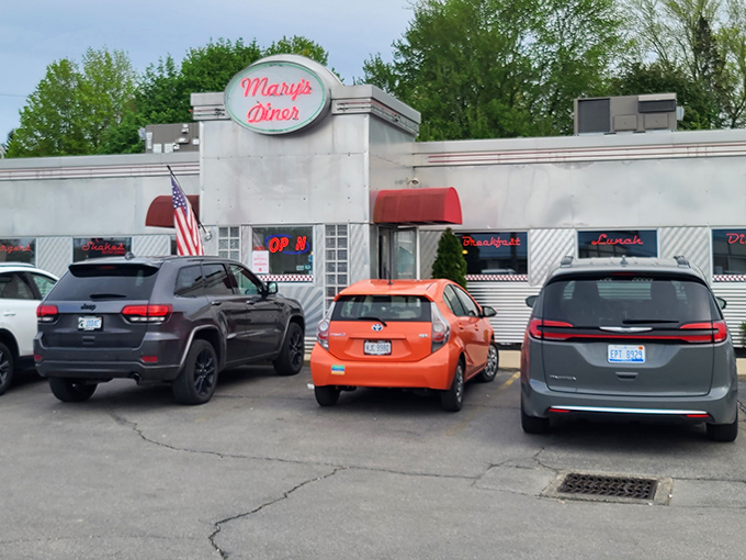 Even on a cloudy day, Mary's Diner's exterior shines like a beacon for hungry travelers, with parking spots that fill quickly when word gets out about their breakfast specials.