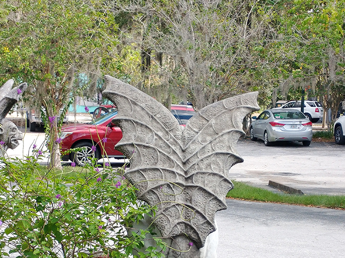 Even the parking lot features whimsical guardians&mdash;stone dragon wings that hint at the magical discoveries waiting inside.