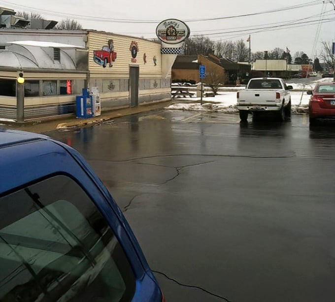 Even in winter, Nancy's Diner beckons hungry travelers like a chrome-clad lighthouse guiding ships through comfort food waters.