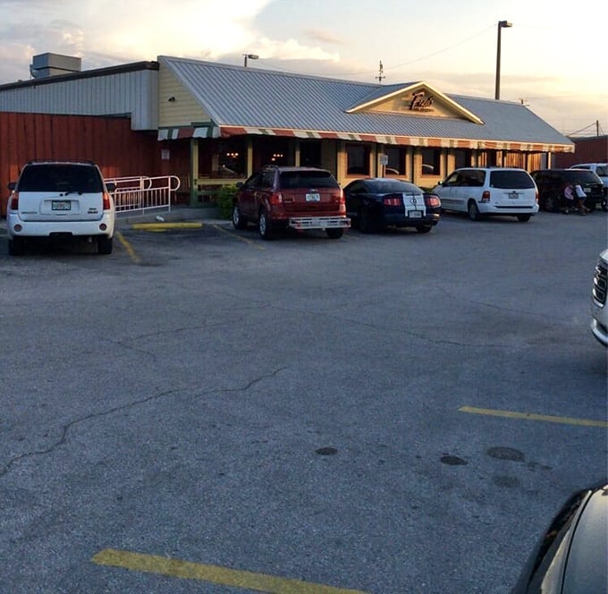 Twilight at Fred's &ndash; when the parking lot fills with cars and the restaurant glows with promise. Southern comfort food beckons as day turns to evening.