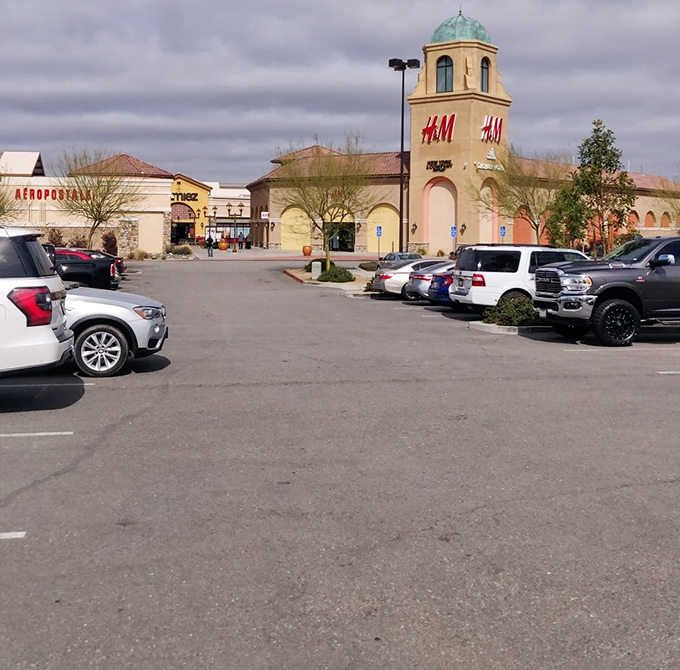 H&M's distinctive turquoise dome rises above the parking lot like a retail lighthouse guiding shoppers safely to harbor in a sea of fashion possibilities.