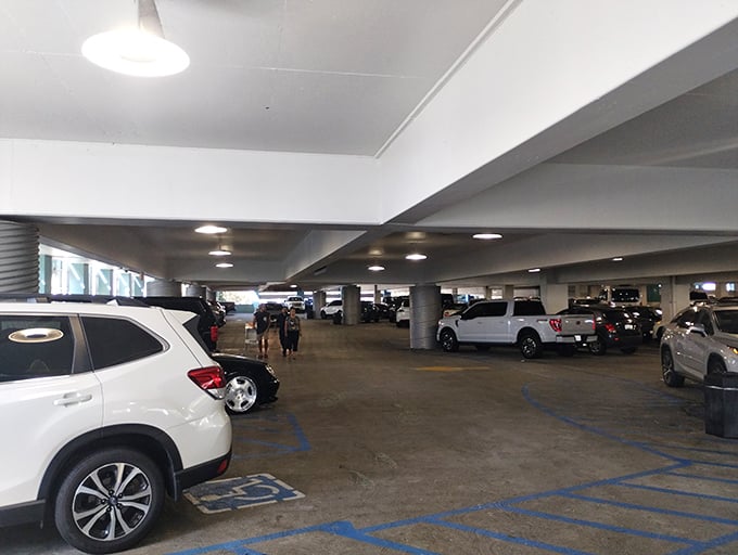 Multi-level parking garages provide shelter and convenience, protecting both cars and shopping bags from elements.