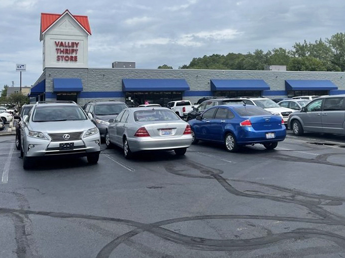 A packed parking lot tells the true story of Valley Thrift's popularity, where vehicles of all makes and models unite in the pursuit of bargains.