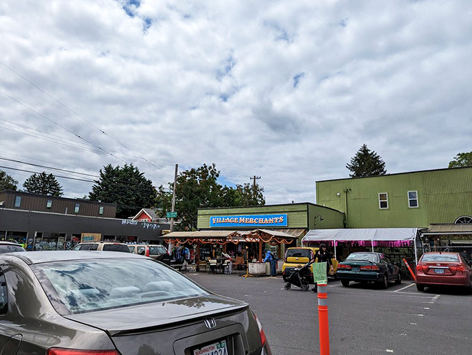 The exterior view reveals Village Merchants' place in the neighborhood ecosystem. Portland's treasure hunters know exactly where to park.