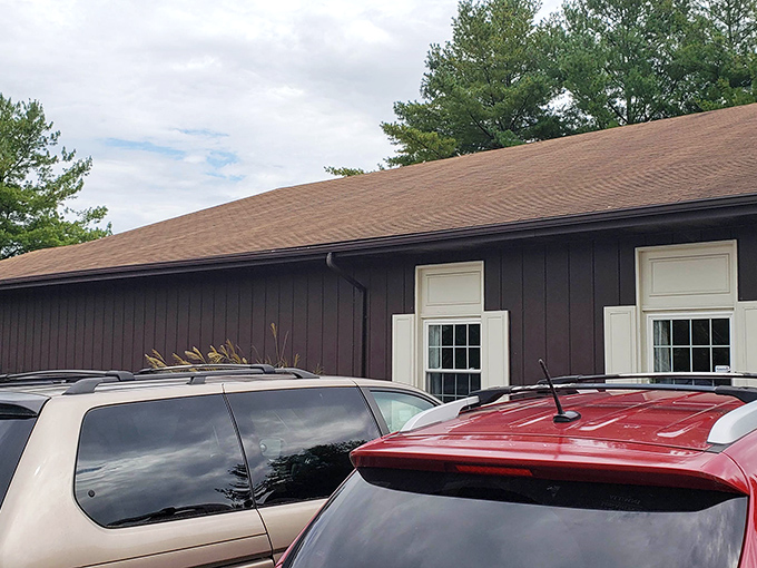 Cars patiently wait while their owners hunt for treasures inside. Even the parking lot has a certain thrift store charm.