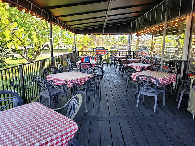 The outdoor seating area with its checkered tablecloths isn't just dining al fresco&mdash;it's Florida's answer to Parisian caf&eacute; culture.