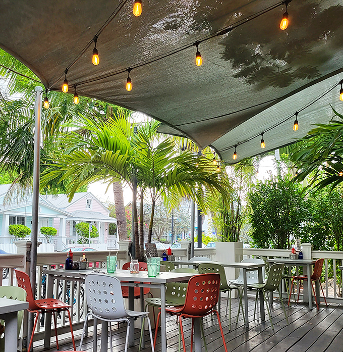 The patio seating area offers a front-row ticket to paradise. Those palm trees aren't just decoration&mdash;they're mood enhancers.