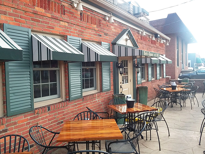 Outdoor tables bathed in dappled sunlight &ndash; where summer afternoons stretch lazily into evening over one more perfect bite.