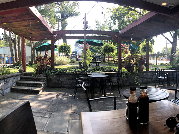 The outdoor patio offers a garden oasis for enjoying your barbecue bounty. Those sauce bottles aren't decorative – they're essential tools.