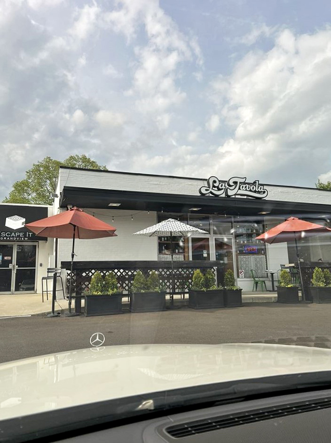 Outdoor seating under cheerful umbrellas offers the perfect spot to twirl pasta while people-watching on sunny Ohio afternoons.
