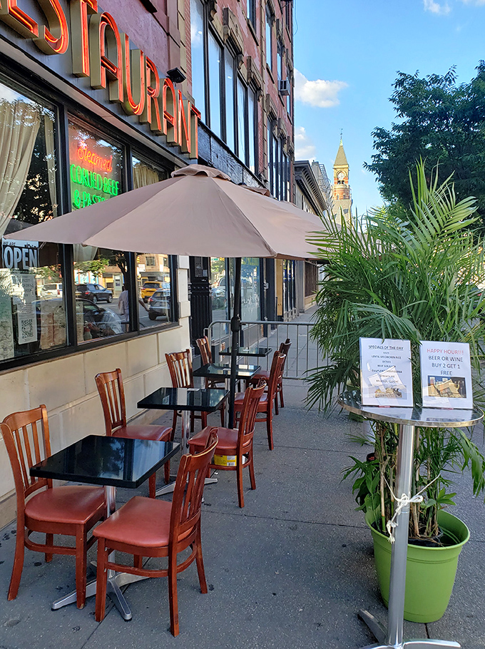 Sidewalk seating offers prime people-watching real estate in the heart of Greenwich Village's energy.