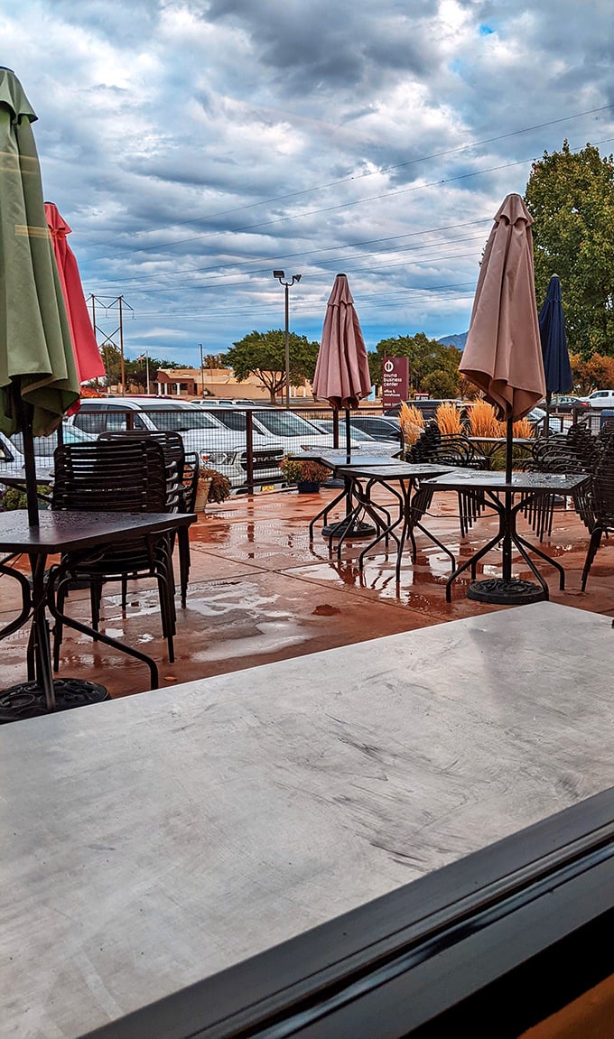 After a rain shower, the patio glistens under dramatic New Mexico skies. Even the weather puts on a show at Vic's.