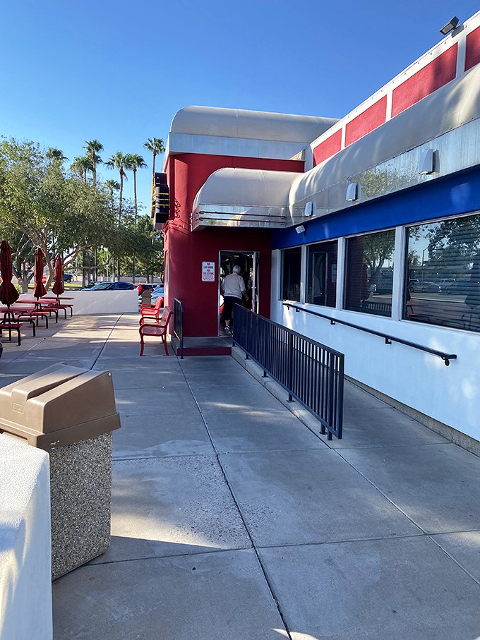 The waiting area features the essential diner checkerboard floor and walls adorned with memories&mdash;visual appetizers before the main event.
