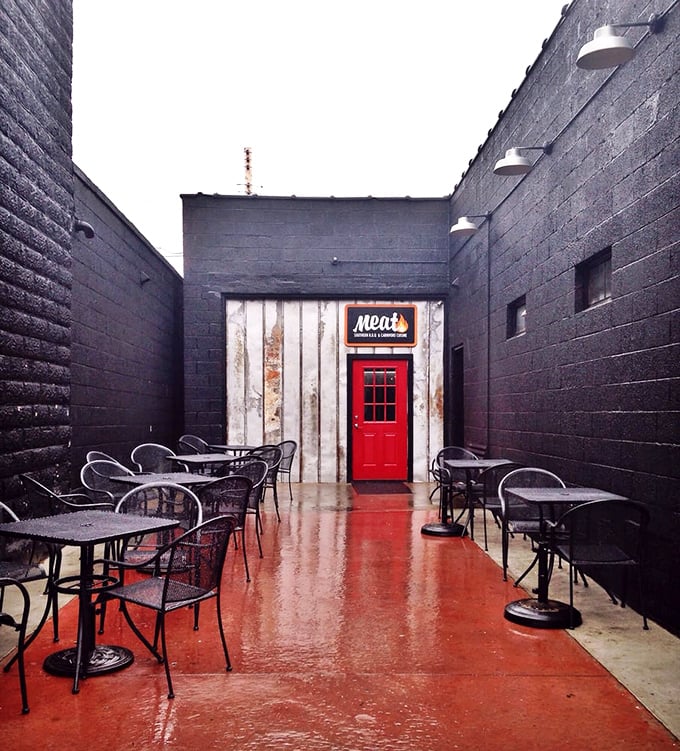 Rain or shine, this courtyard calls. Black walls frame the bright red door like a portal to a dimension where calories don't count and napkins are unlimited.