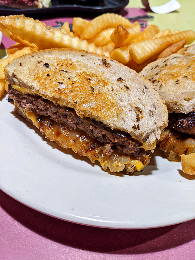 This patty melt with golden fries isn't just lunch &ndash; it's a masterclass in how grilled onions and melted cheese can solve most of life's problems.