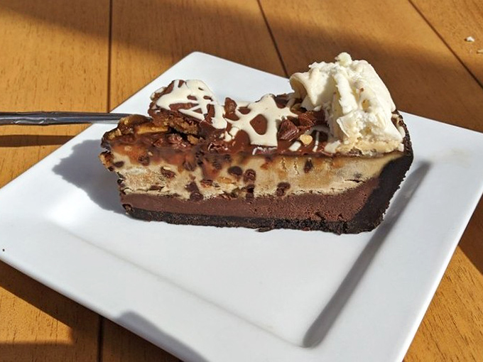 Layer upon layer of chocolate and peanut butter decadence. This slice doesn't just end your meal&mdash;it becomes the reason you came.