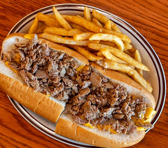 A proper cheesesteak sandwich that doesn't skimp on the meat, paired with fries that could stand alone as a worthy meal.