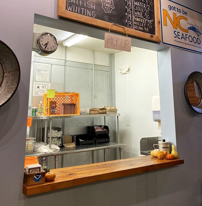 The pickup window&mdash;where dreams come true and paper bags transform into treasure chests of perfectly fried coastal bounty.