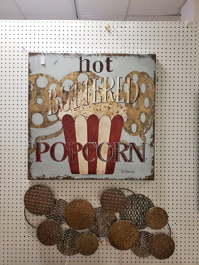 Nothing says "my kitchen has personality" quite like vintage popcorn signage that reminds guests of simpler, butterier times.
