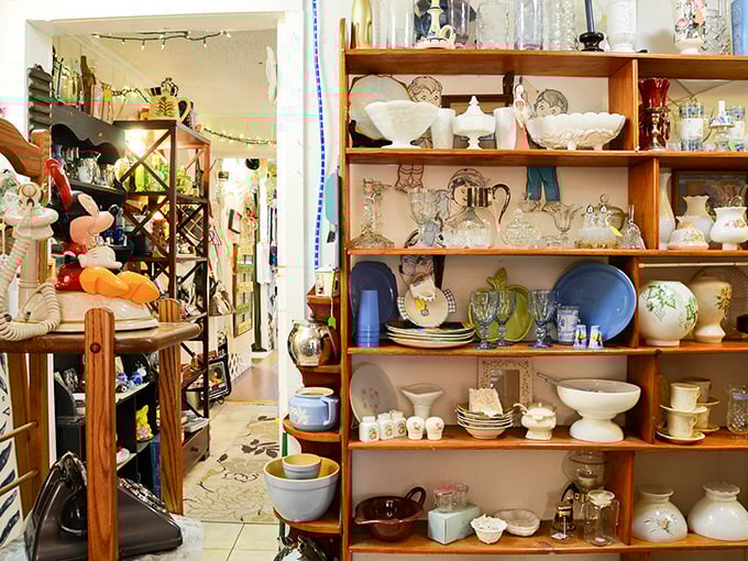 Porcelain figurines and delicate dishware stand at attention, a ceramic army of elegance from dining rooms of decades past.