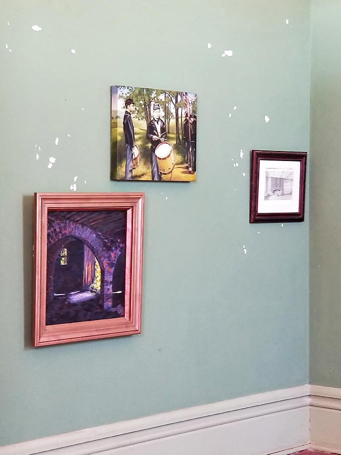 Historical portraits and artwork remind visitors that real families once called these grand rooms their everyday home.