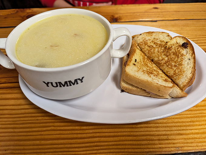 A bowl proudly labeled "YUMMY" isn't being presumptuous when filled with potato soup this good. The grilled sandwich stands by, ready for dunking duty.