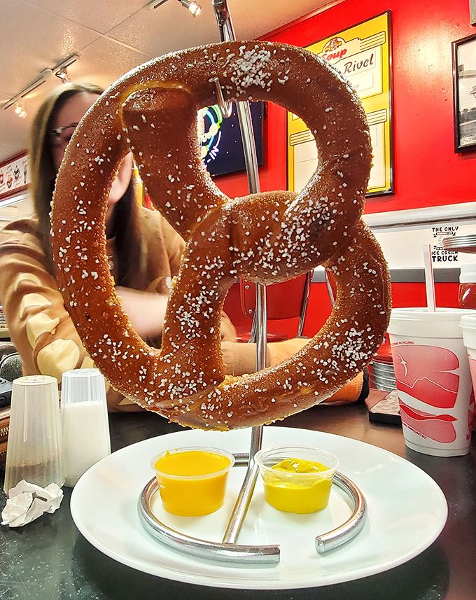 The pretzel isn't just big&mdash;it's Ohio-ambitious, suspended dramatically like edible performance art with mustard dipping sauce as its supporting actor.