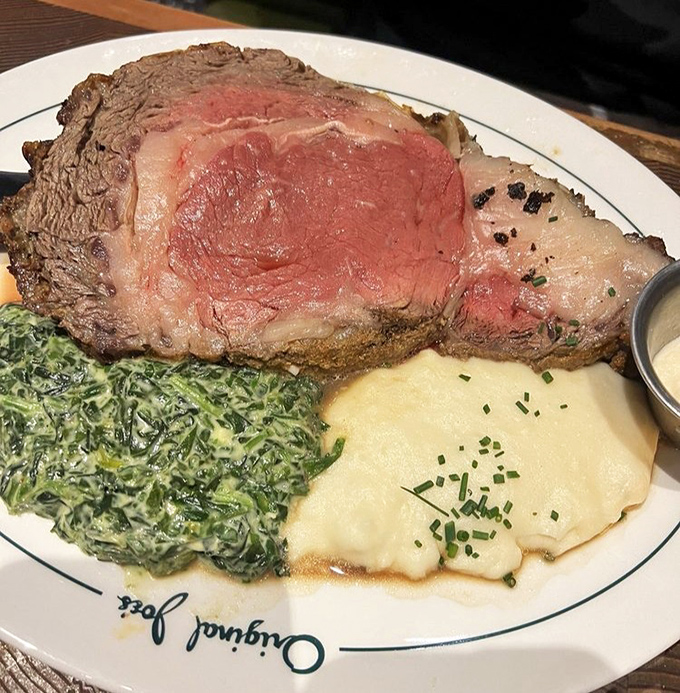 Prime rib cooked with the reverence it deserves, accompanied by creamed spinach and potatoes that refuse to be mere sidekicks.