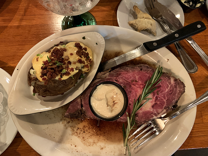 Prime rib that's exactly the right shade of pink, with a loaded baked potato sidekick that deserves equal billing on the marquee.