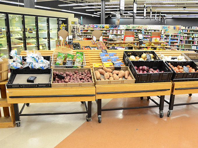 Fresh produce displayed on rustic wooden stands brings farmers' market vibes without the farmers' market prices.