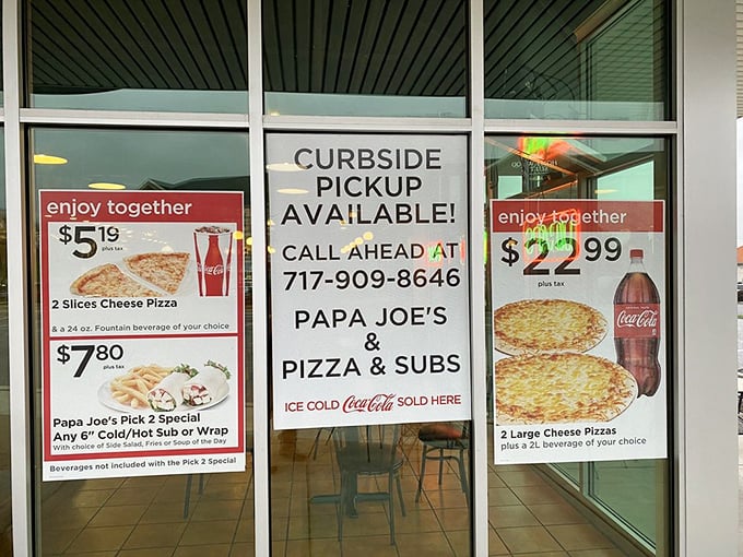 Deals so good they had to put them on the window. The universal language of pizza bargains speaks to us all.