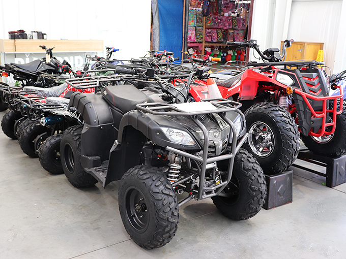 Adventure machines lined up like a showroom for weekend warriors. These ATVs aren't just transportation&mdash;they're freedom on four wheels with attitude.