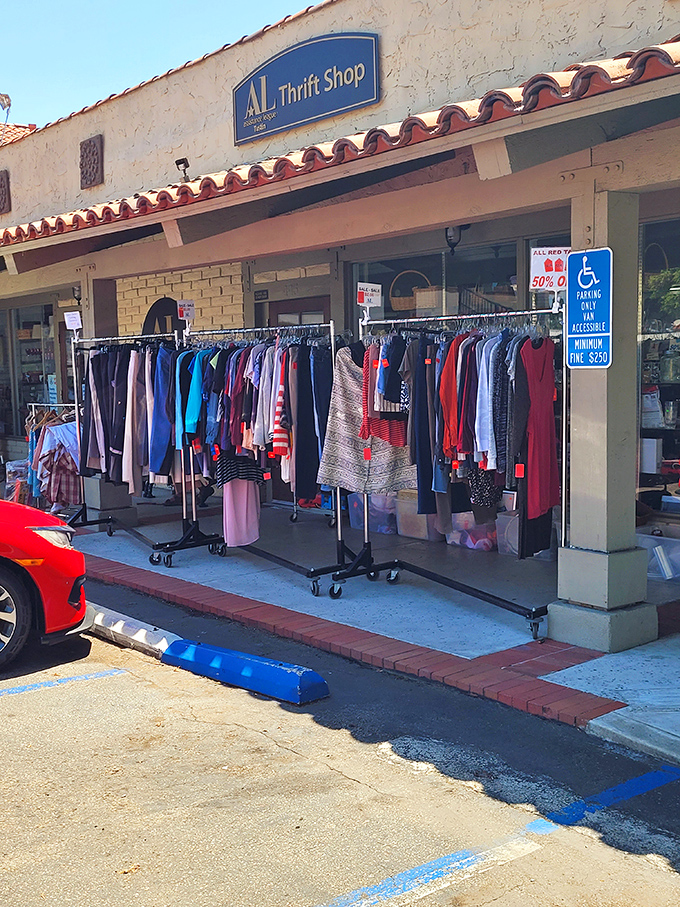 Sidewalk shopping adds to the treasure hunt experience &ndash; these racks of colorful clothing beckon to passing cars like a siren song of savings.