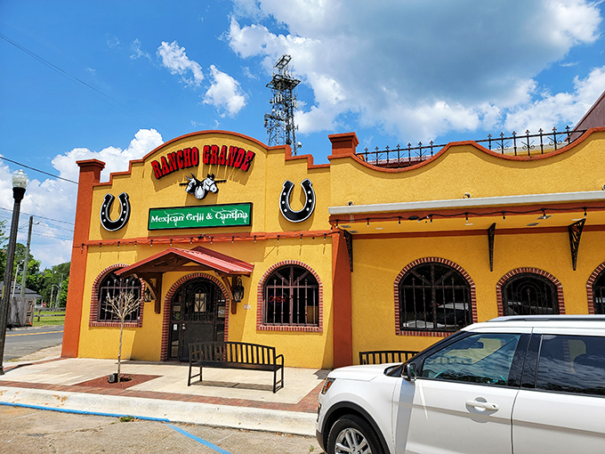 Rancho Grande's vibrant yellow exterior is like a sunny welcome mat, promising authentic Mexican flavors in this quintessentially Southern town.