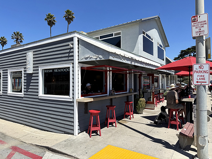 Fresh seafood tastes better when eaten outdoors on red stools, where paper napkins dance in the breeze and calories don't count.