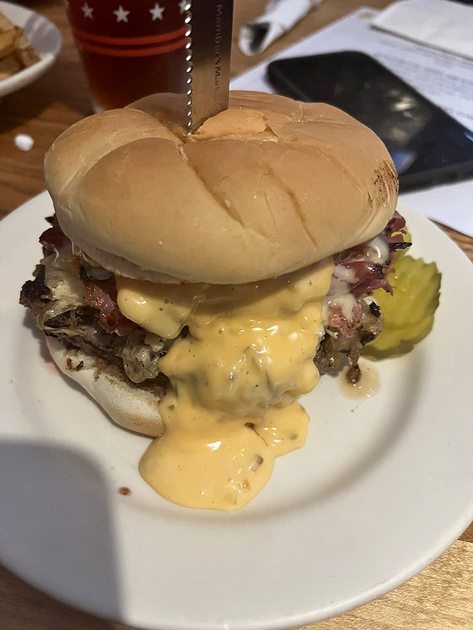 Cheese sauce isn't just a topping here&mdash;it's a philosophy. This burger embraces excess in all the right ways, demanding both napkins and respect.