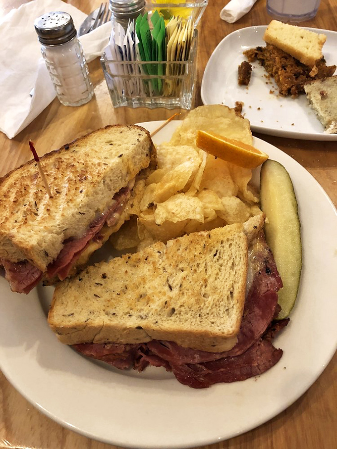 The Reuben &ndash; where corned beef, sauerkraut and Russian dressing hold their delicious summit between grilled rye bread borders.
