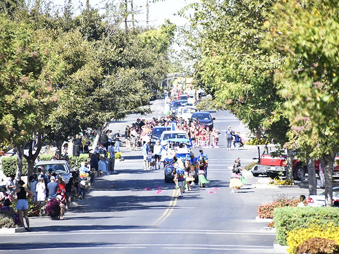 During the Bass Derby parade, Main Street transforms from quiet thoroughfare to community living room, where everyone has a front-row seat to small-town joy.